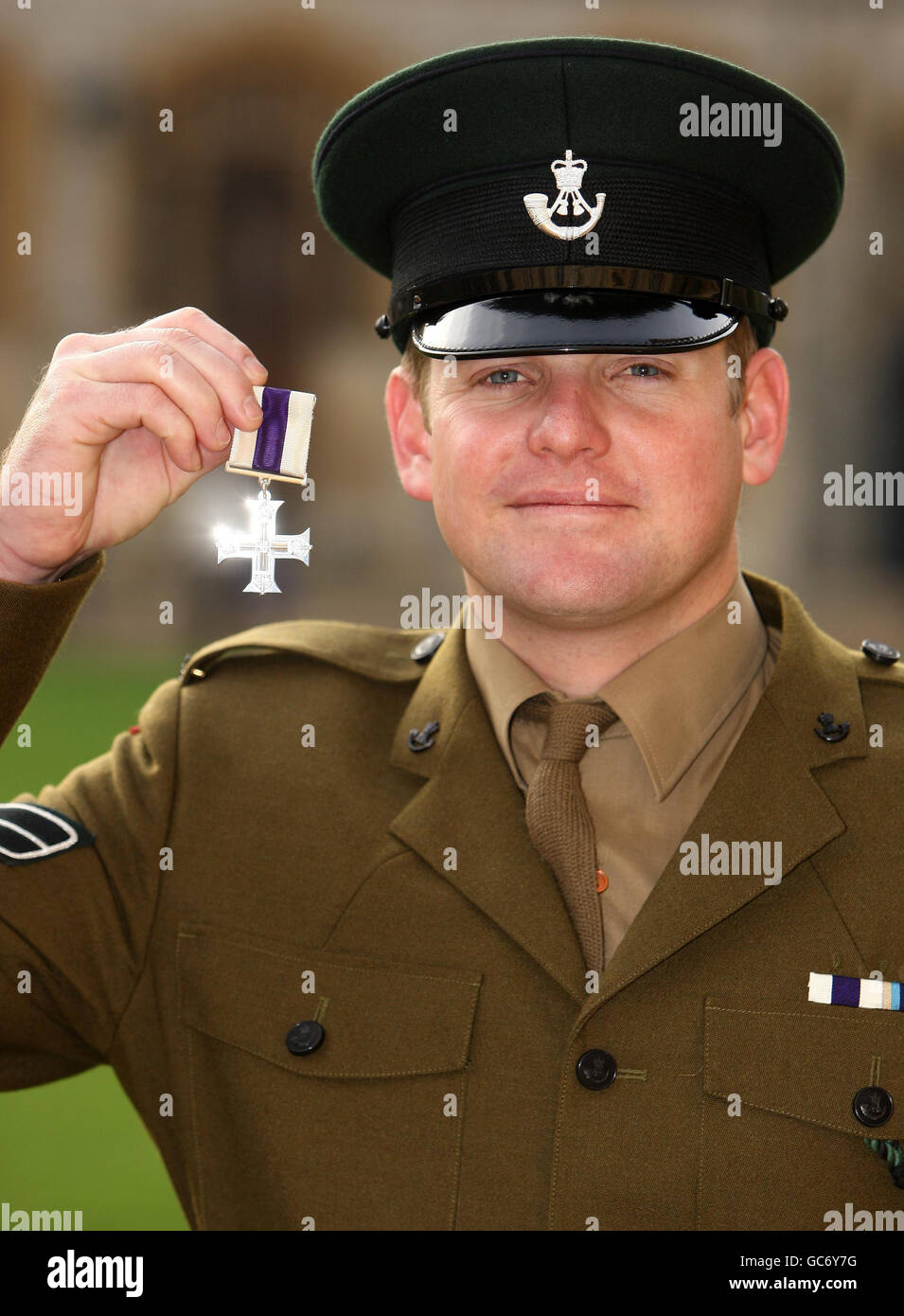 Sergeant Mark Powis, The Rifles, holds his Military Cross, which he ...