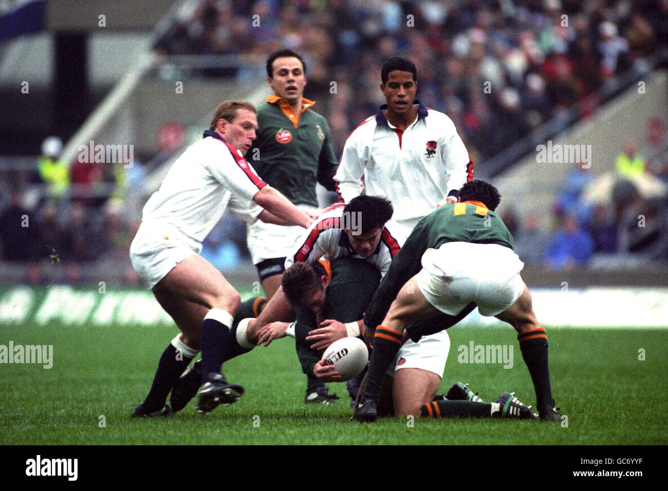 WILL CARLING TACKLES A SOUTH AFRICAN PLAYER WHILE JEREMY GUSCOTT ...