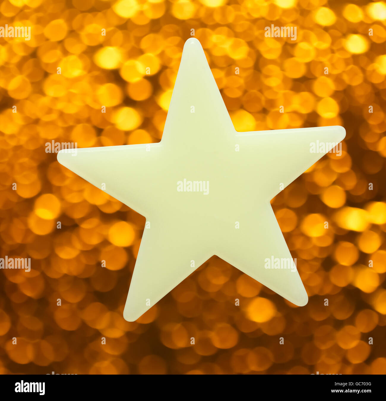 Blank star on blur background in closeup Stock Photo - Alamy