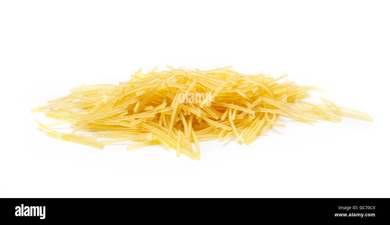 Short thin pasta tubes on white background Stock Photo - Alamy