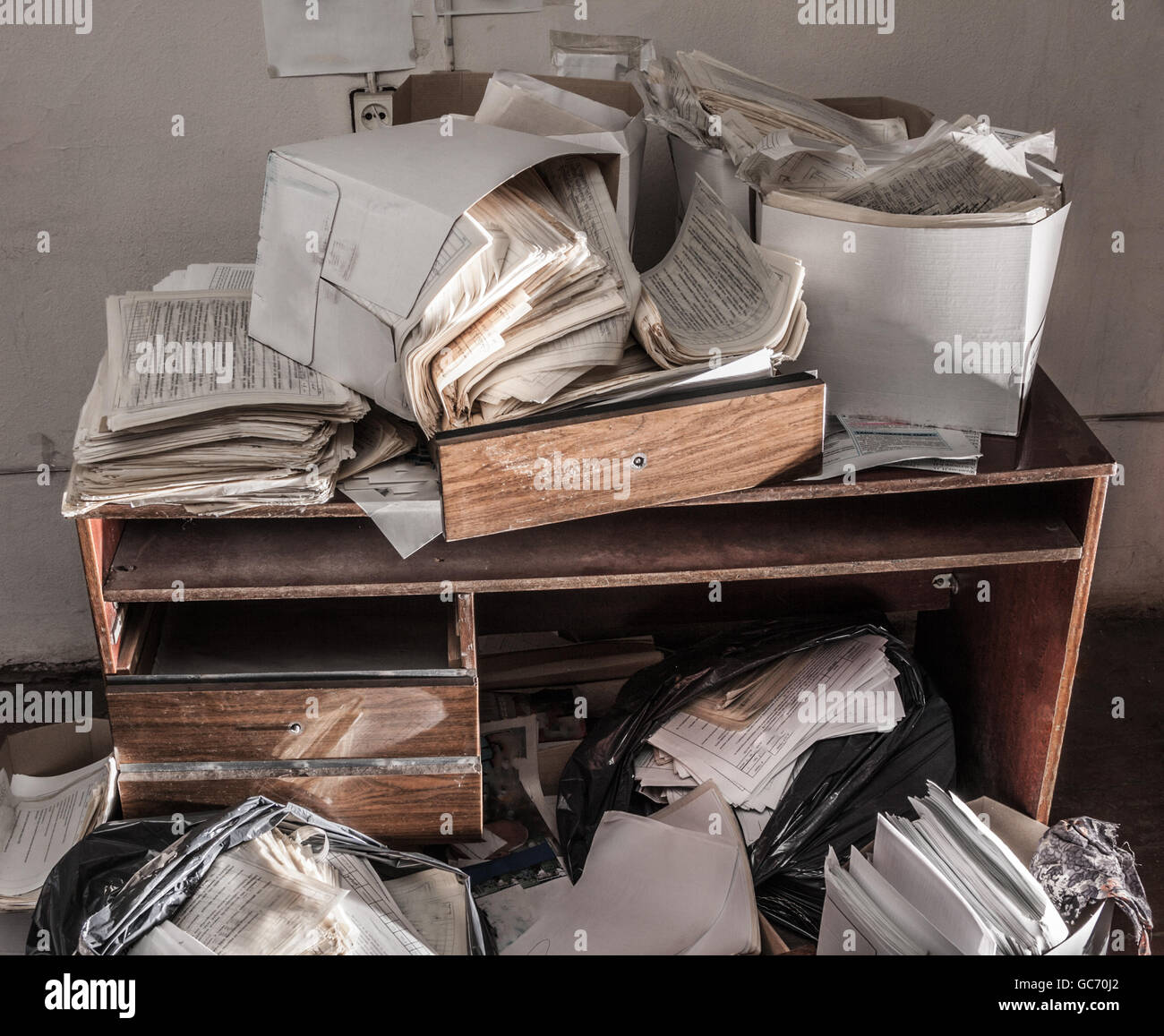 Messy workplace with stack of the paper Stock Photo - Alamy