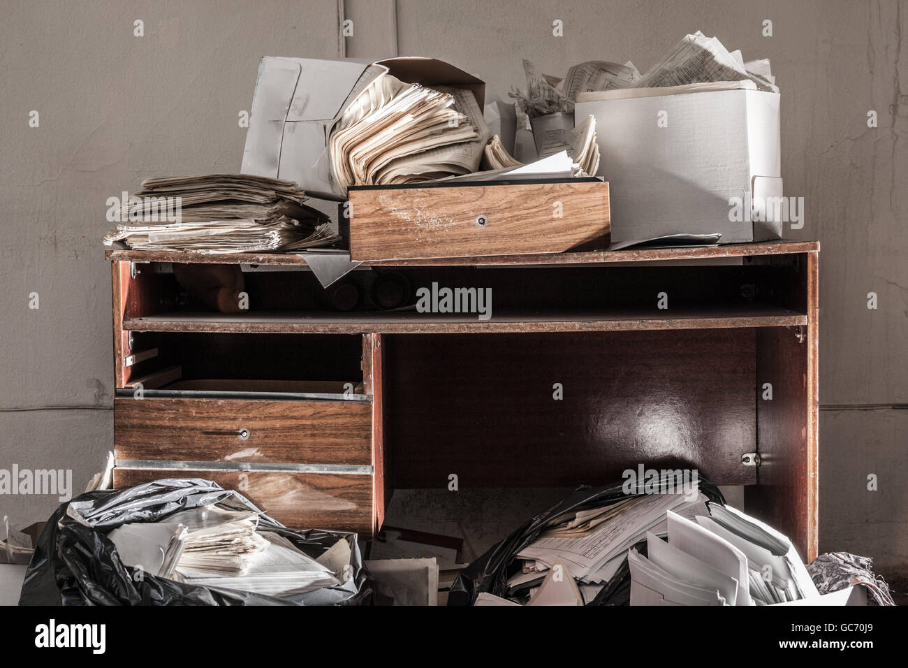 Messy workplace with stack of the paper Stock Photo - Alamy