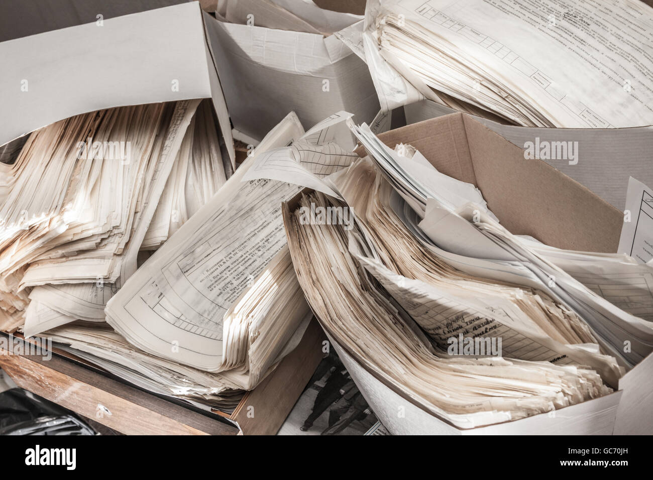 Messy workplace with stack of the paper Stock Photo - Alamy