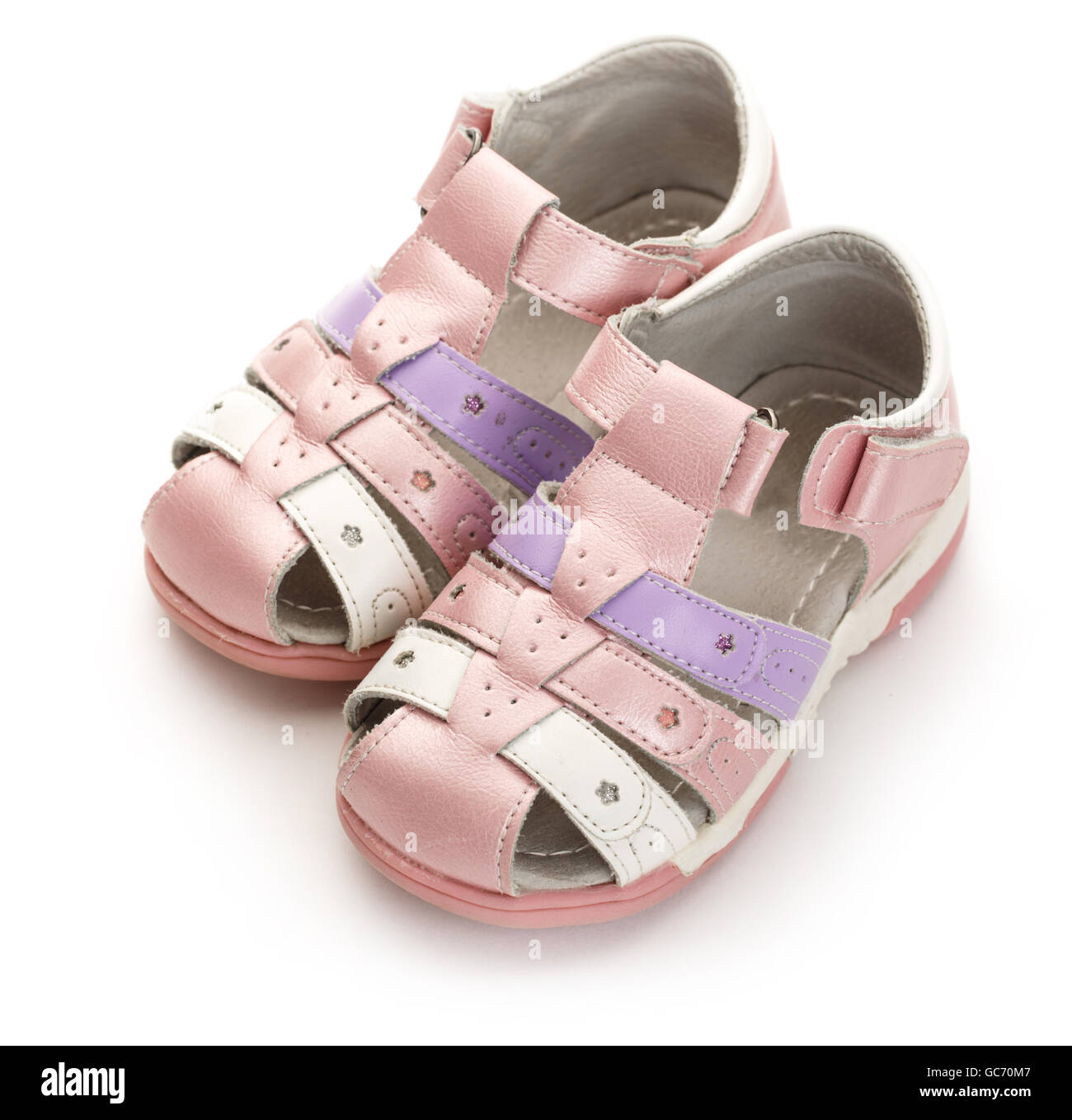 Girl's pink sandals on white background closeup Stock Photo - Alamy