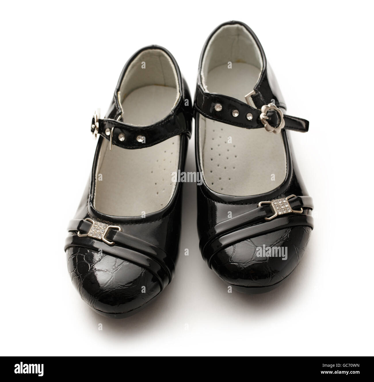 Girl's black classic shoes on white background Stock Photo - Alamy