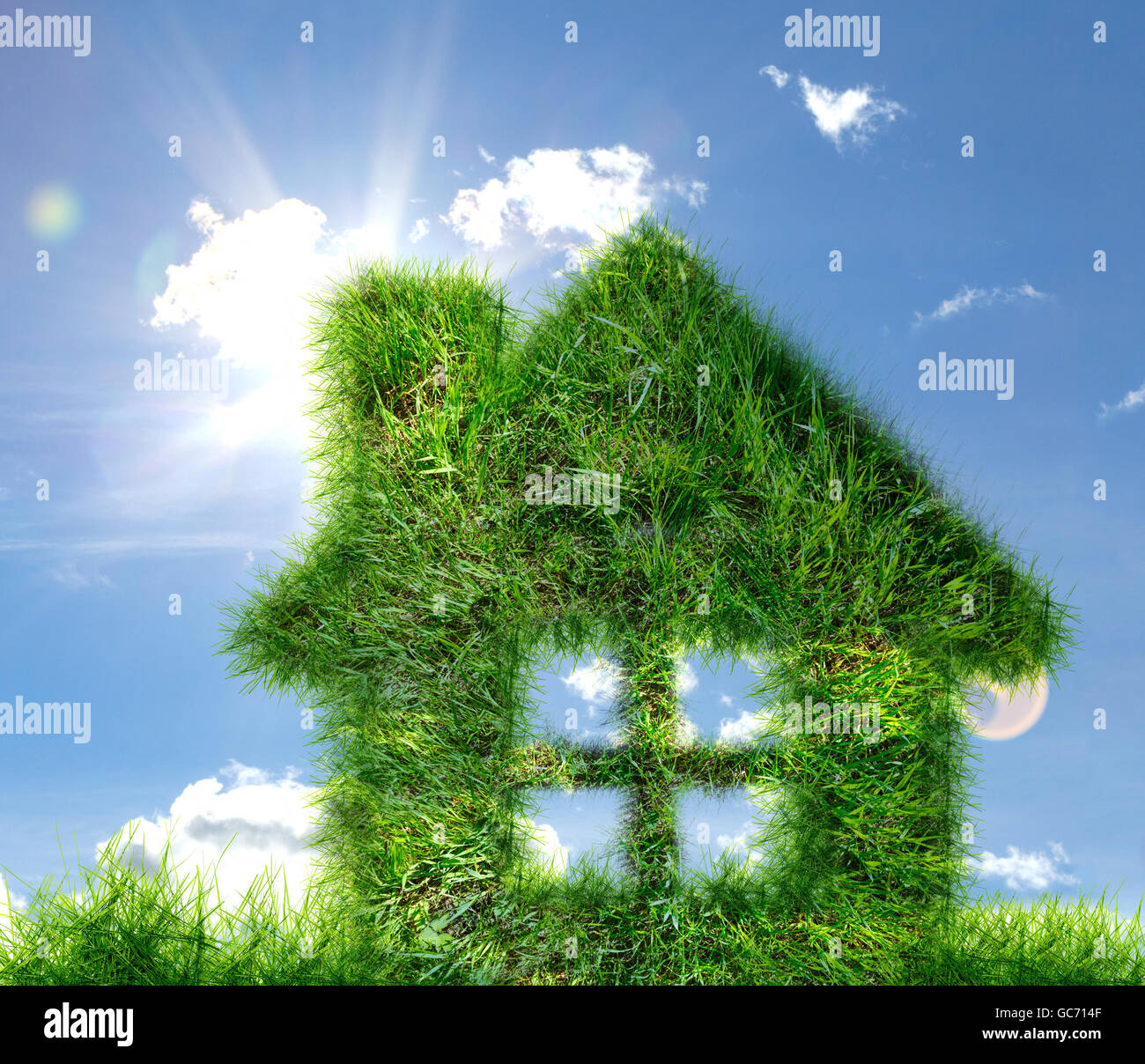 House made of green grass on blue sky background Stock Photo - Alamy