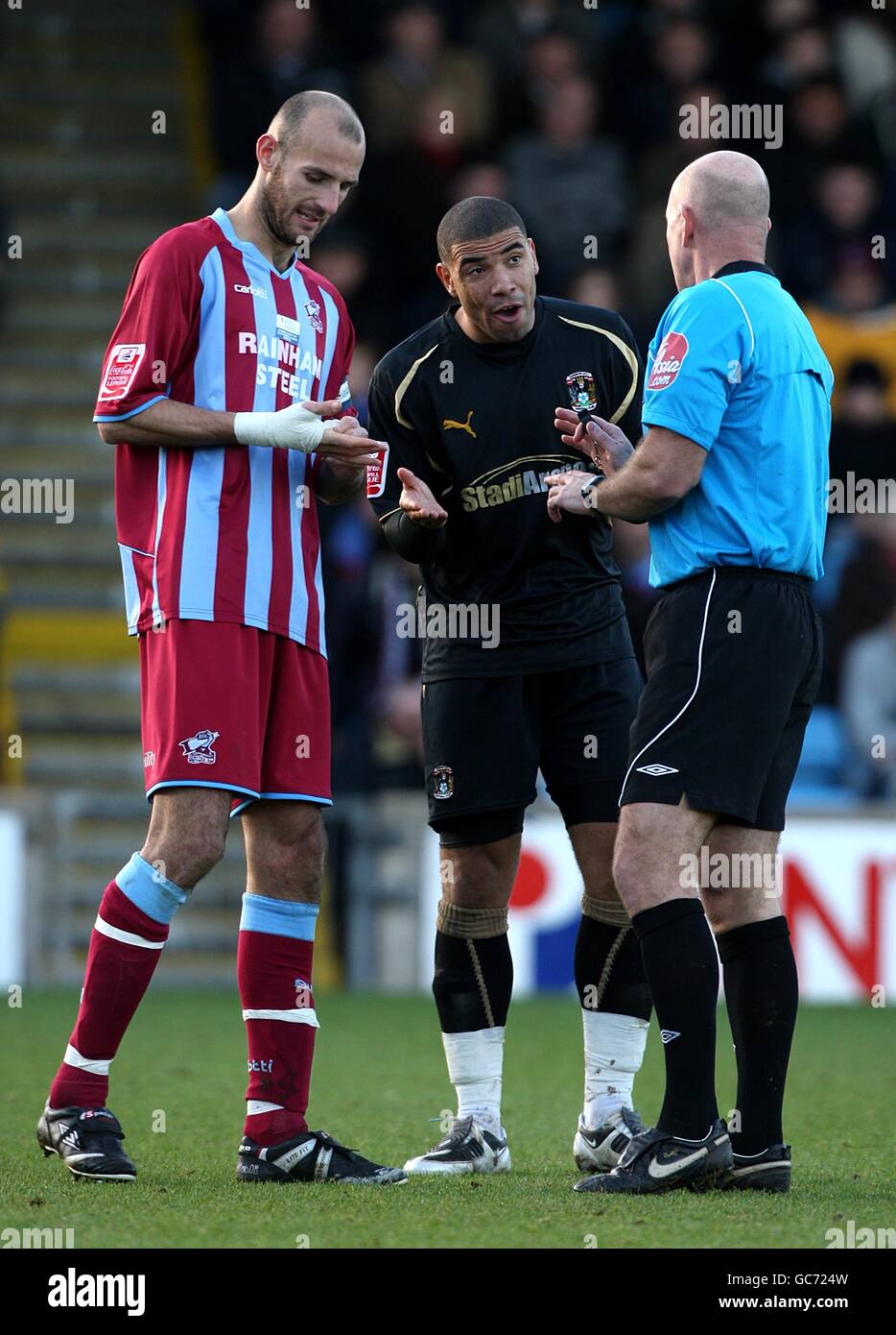 Coventry City's Clinton Morrison (centre) argues with referee Nigel ...