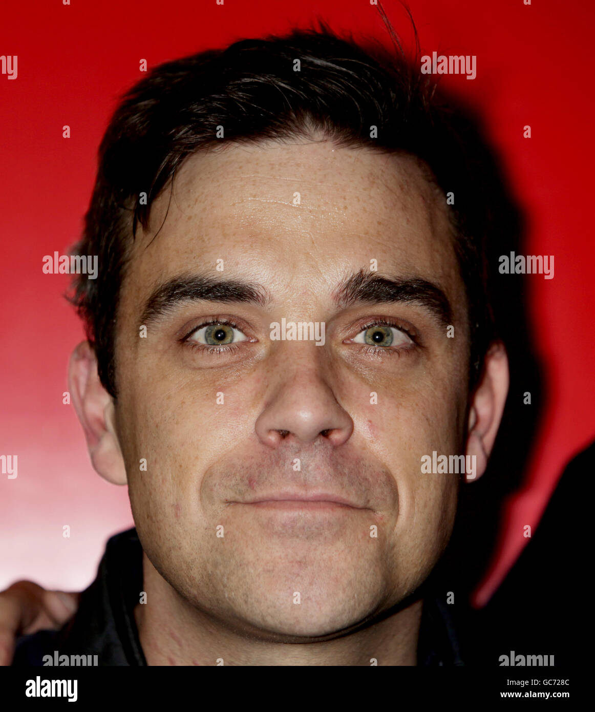 Robbie Williams with Heart presenters Jamie Theakston and Harriet Scott ...