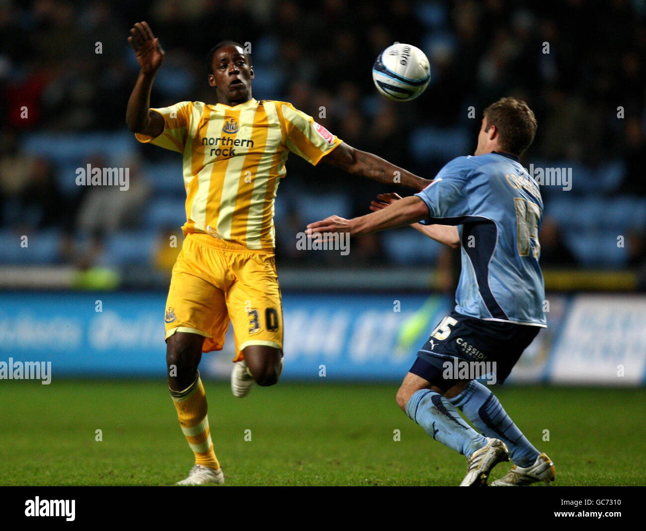 Newcastle's Nile Ranger (left) is challenged by Coventry's Martin ...