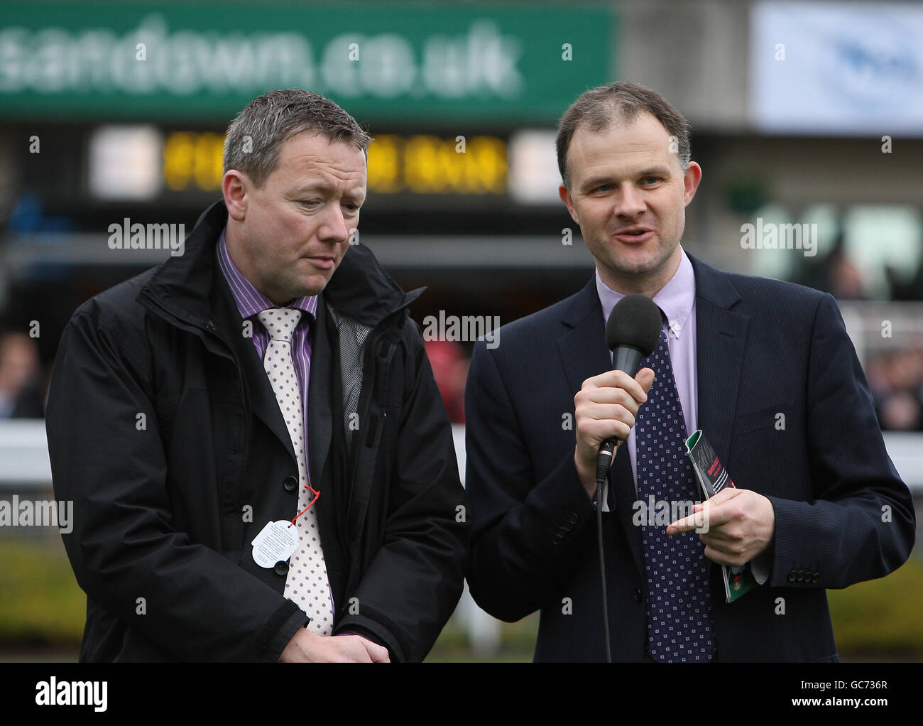 Sandown compere Anthony Kemp (right) does a piece to camera in the ...