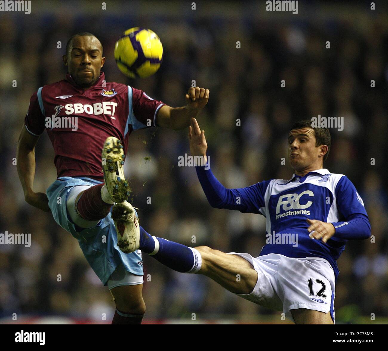 Birmingham City's Barry Ferguson (right) and West Ham United's Daniel ...