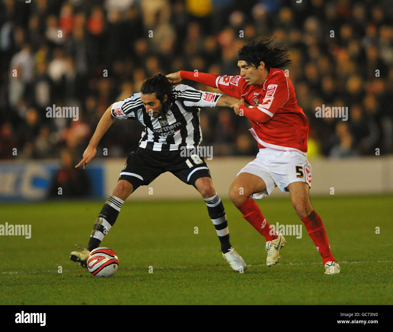 Barnsley's Hugo Colace and Newcastle United's Jonas Gutierrez battle ...