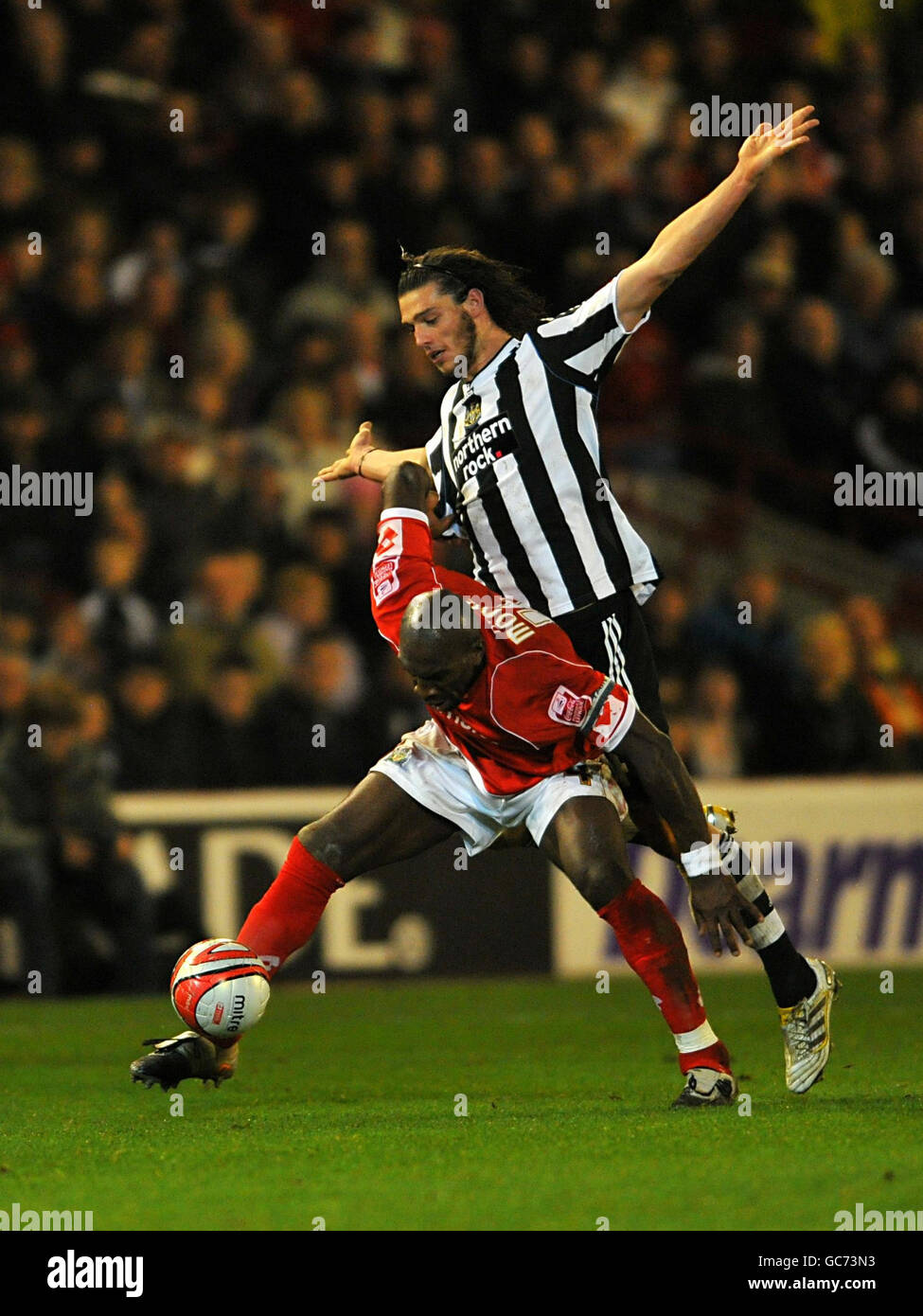 Barnsley's Darren Moore and Newcastle United's Andy Carroll battle for ...