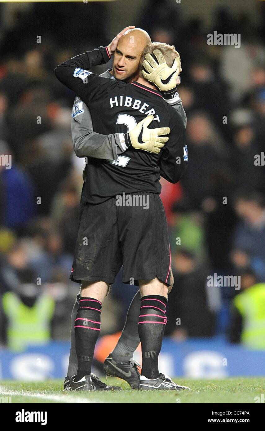 Everton's Tony Hibbert and goalkeeper Tim Howard (behind) embrace Stock ...