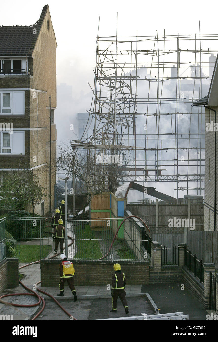 Firefighters at the scene of a fire in peckham hi-res stock photography ...