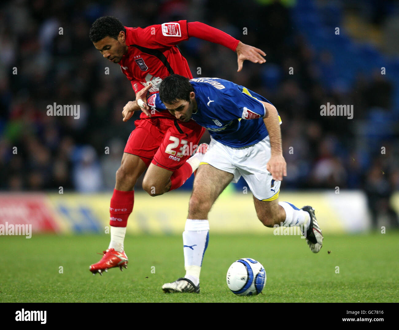 Cardiff City's Peter Whittingham holds off the challenge of Ipswich ...