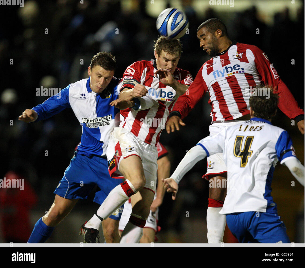 Exeter City's Richard Logan heads at goal ahead of team mate Danny ...