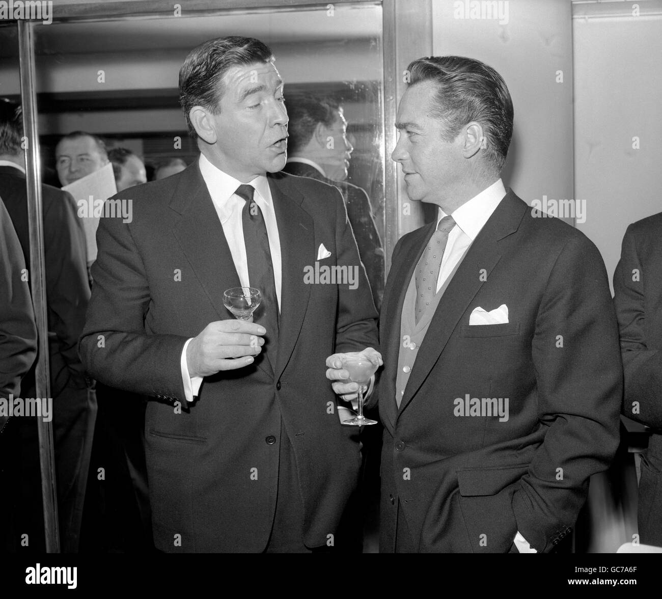 Actors Robert Beatty (left) and Richard Todd talk 'shop' as they enjoy ...