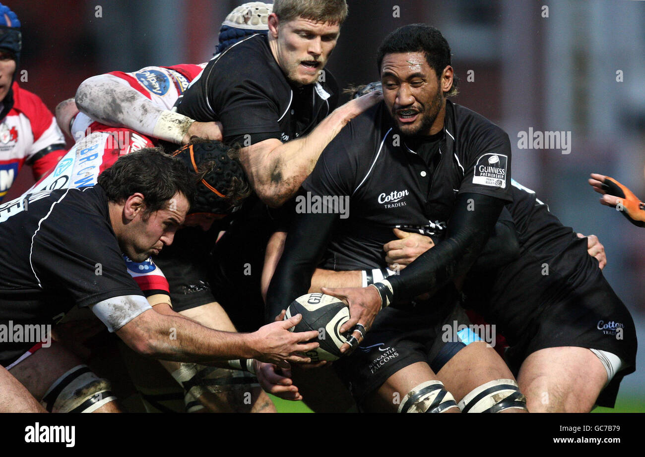 Newcastle's Josh Afu (right) hands the ball to teammate Carl Hayman ...
