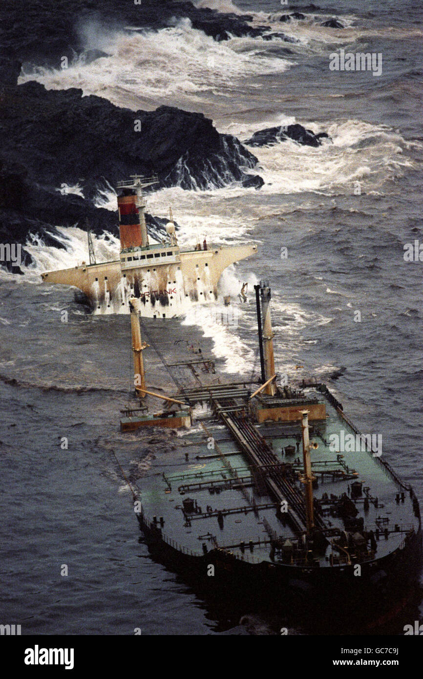 The Tanker Braer lies wedged onto the rocks still spewing oil as gale ...