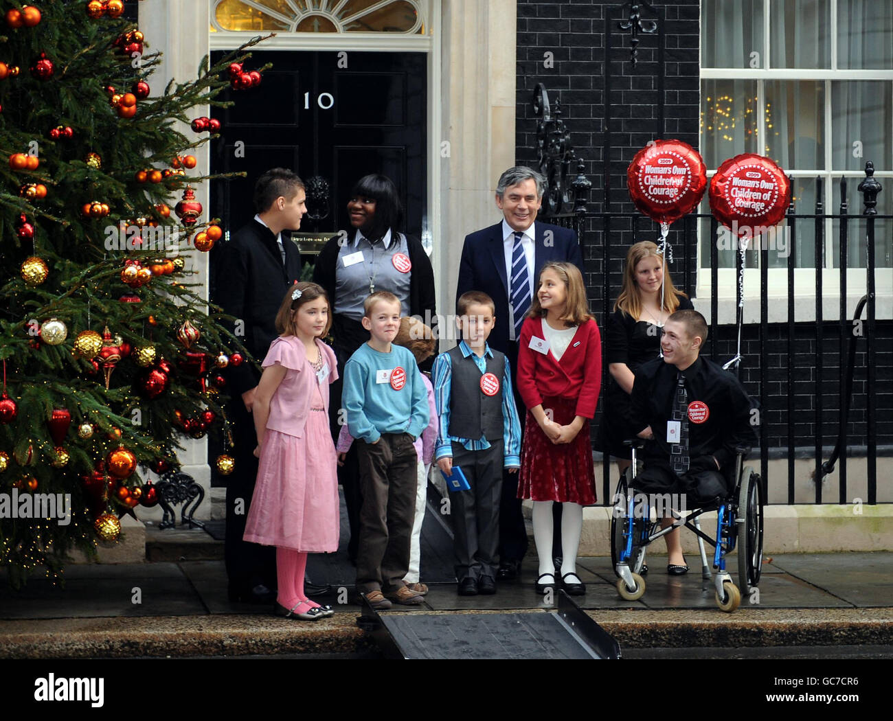 Britain's Prime Minister Gordon Brown poses with the Woman's Own ...