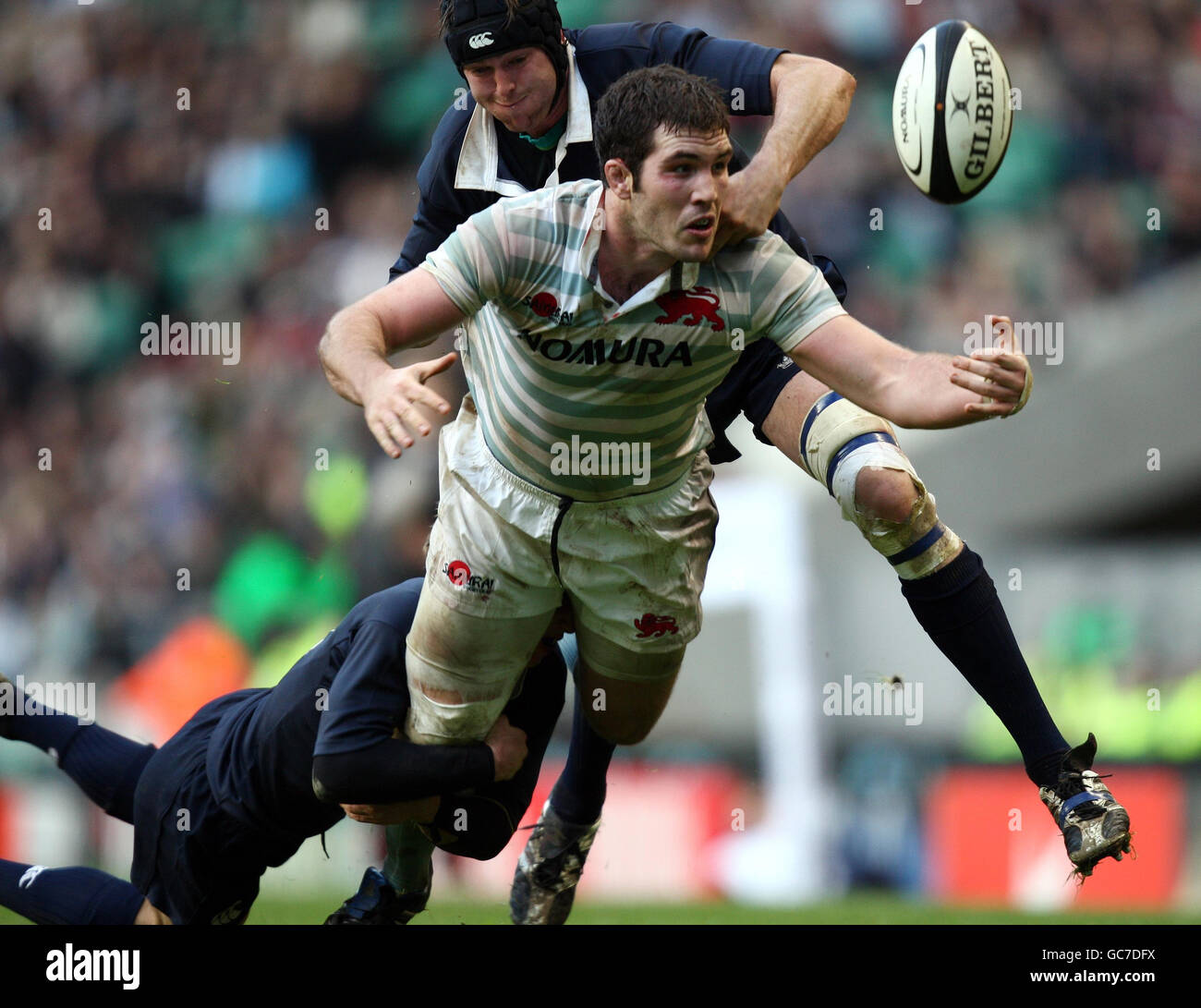 Cambridge's Ben Maidment of loses control of the ball as he is tackled ...