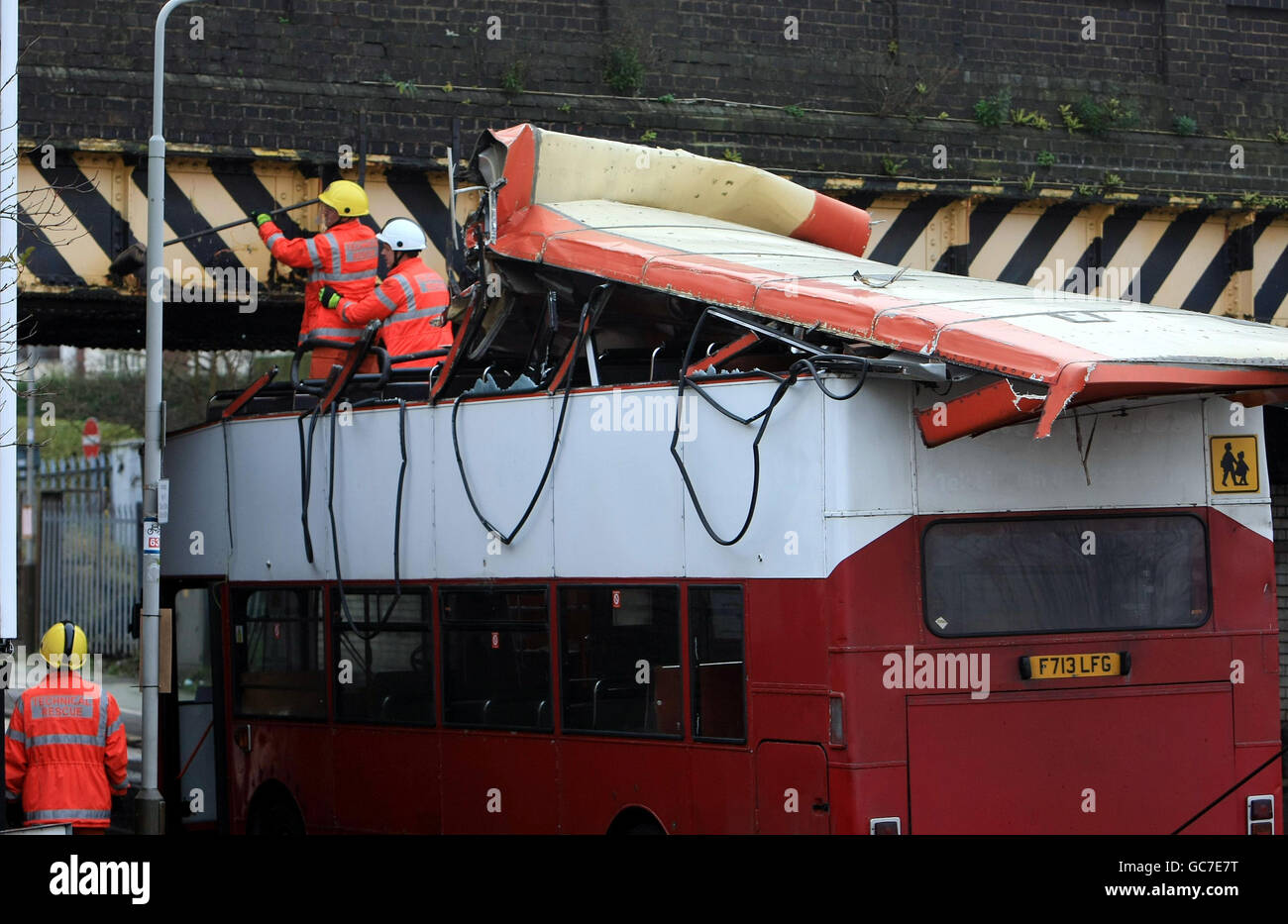 A double-decker bus full of school children had its roof ripped off ...