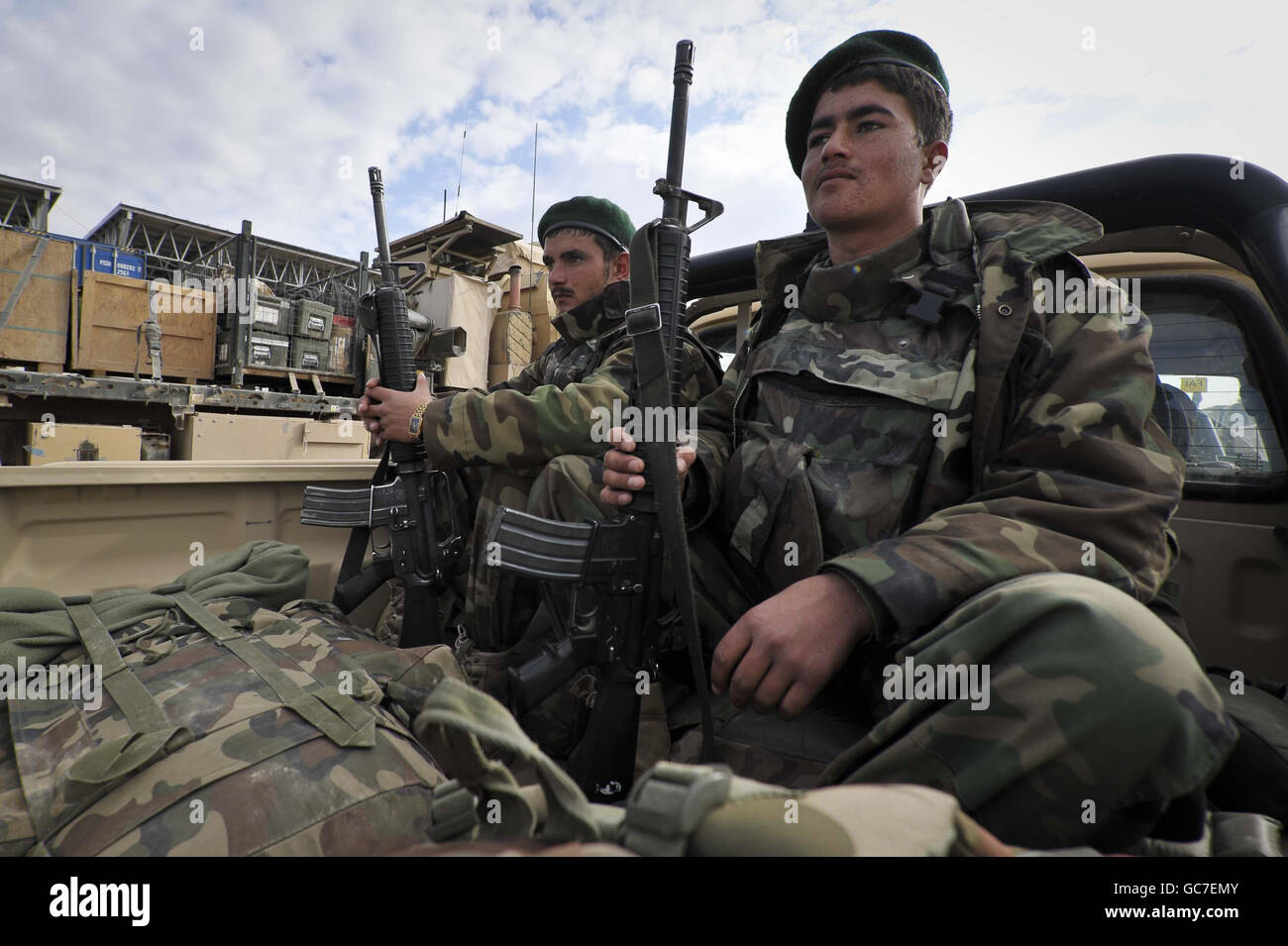 Afghan National Army soldiers aboard a 4x4 vehicle as they and other ...