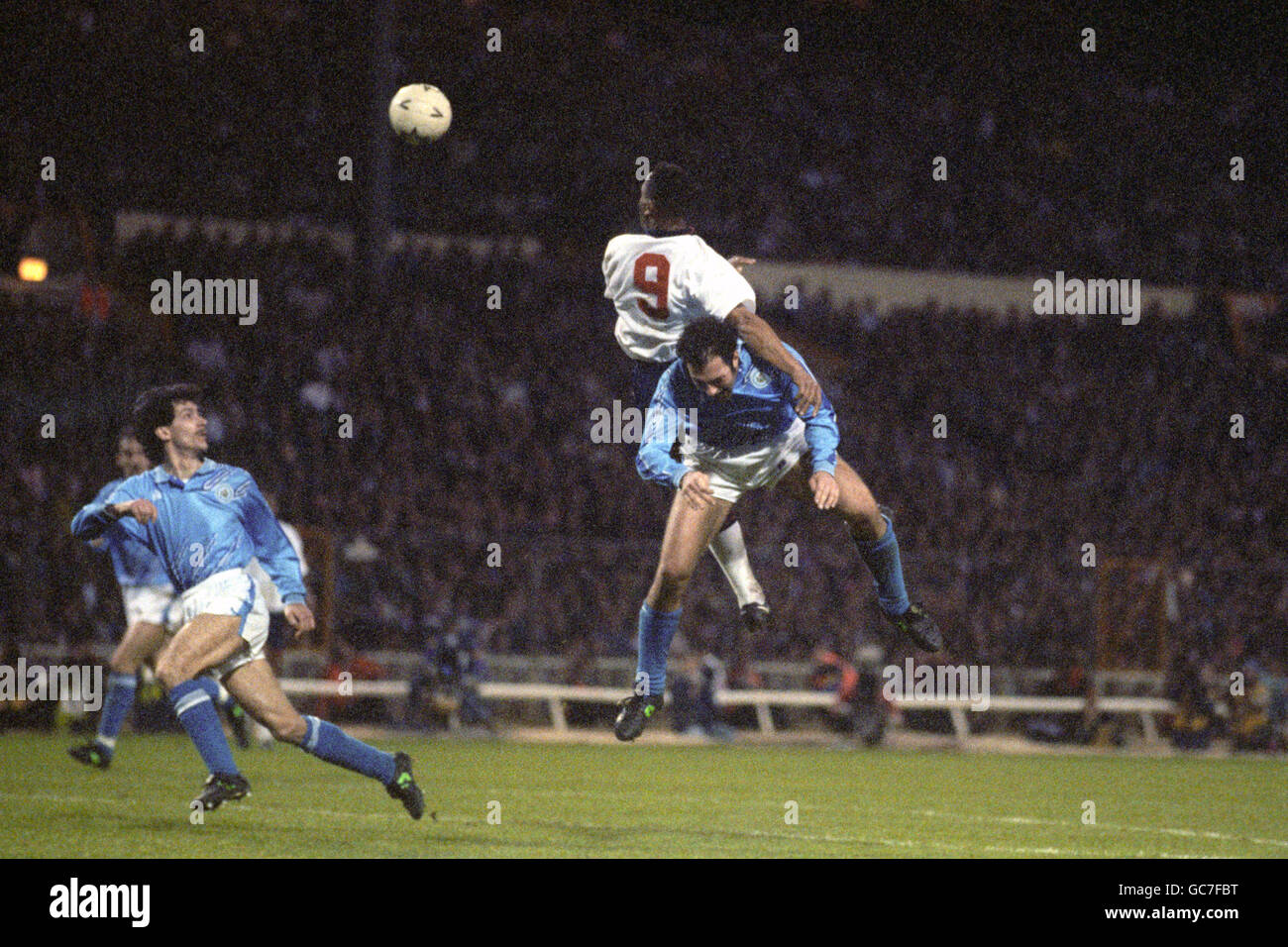 NEW ENGLAND CAP, LES FERDINAND JUMPS FOR A HIGH BALL AND SCORES DURING ...