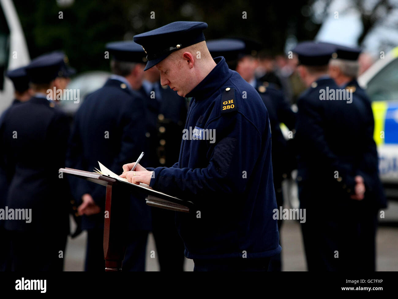 Gardai sign the book of condolences at the funeral of Garda Gary ...