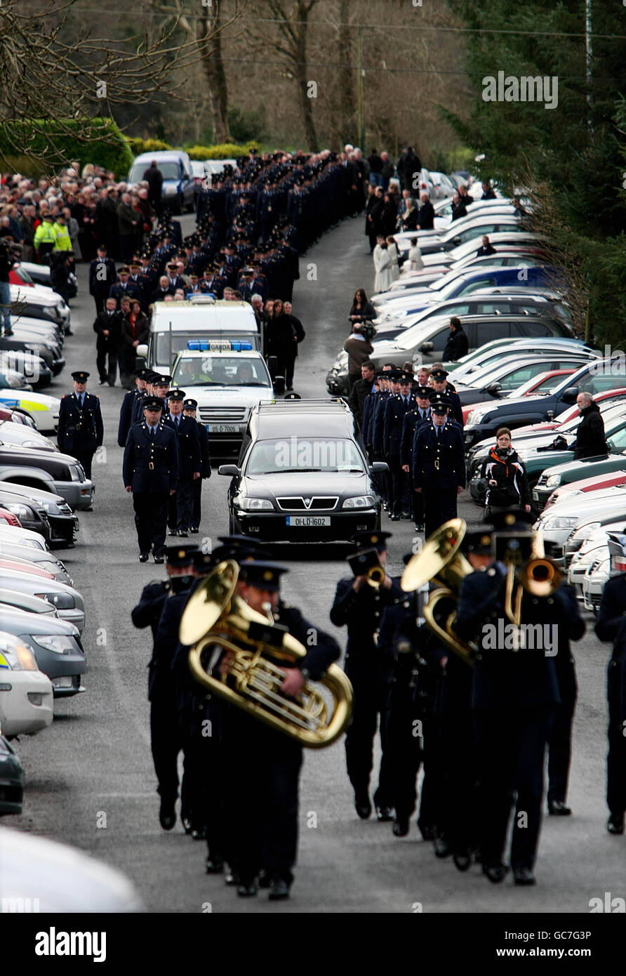 The funeral cortege for Garda Gary McLoughlin, makes its way to St ...