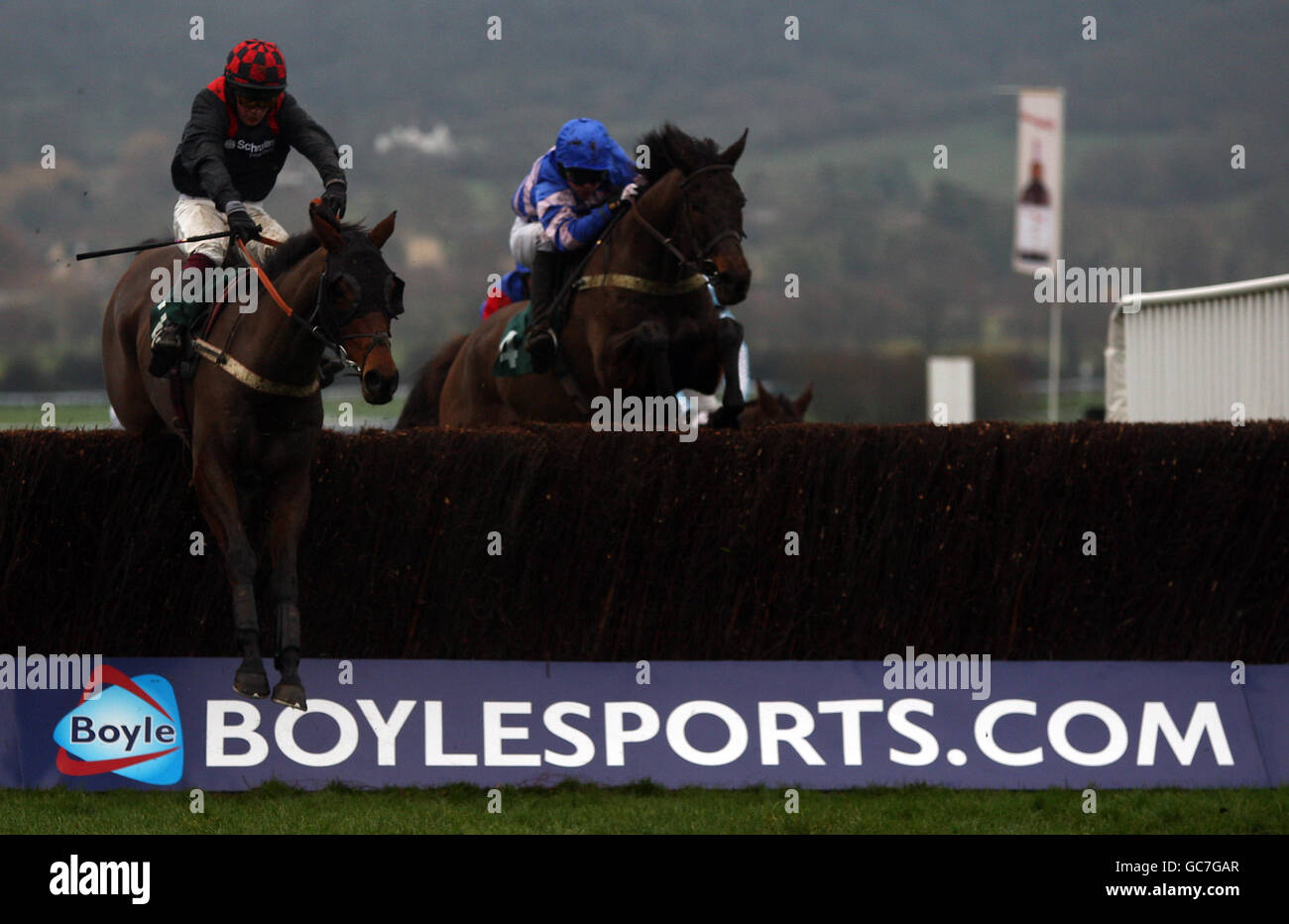 Jockey Charlie Huxley on Sovereign King (left) jumps ahead of Tjade ...