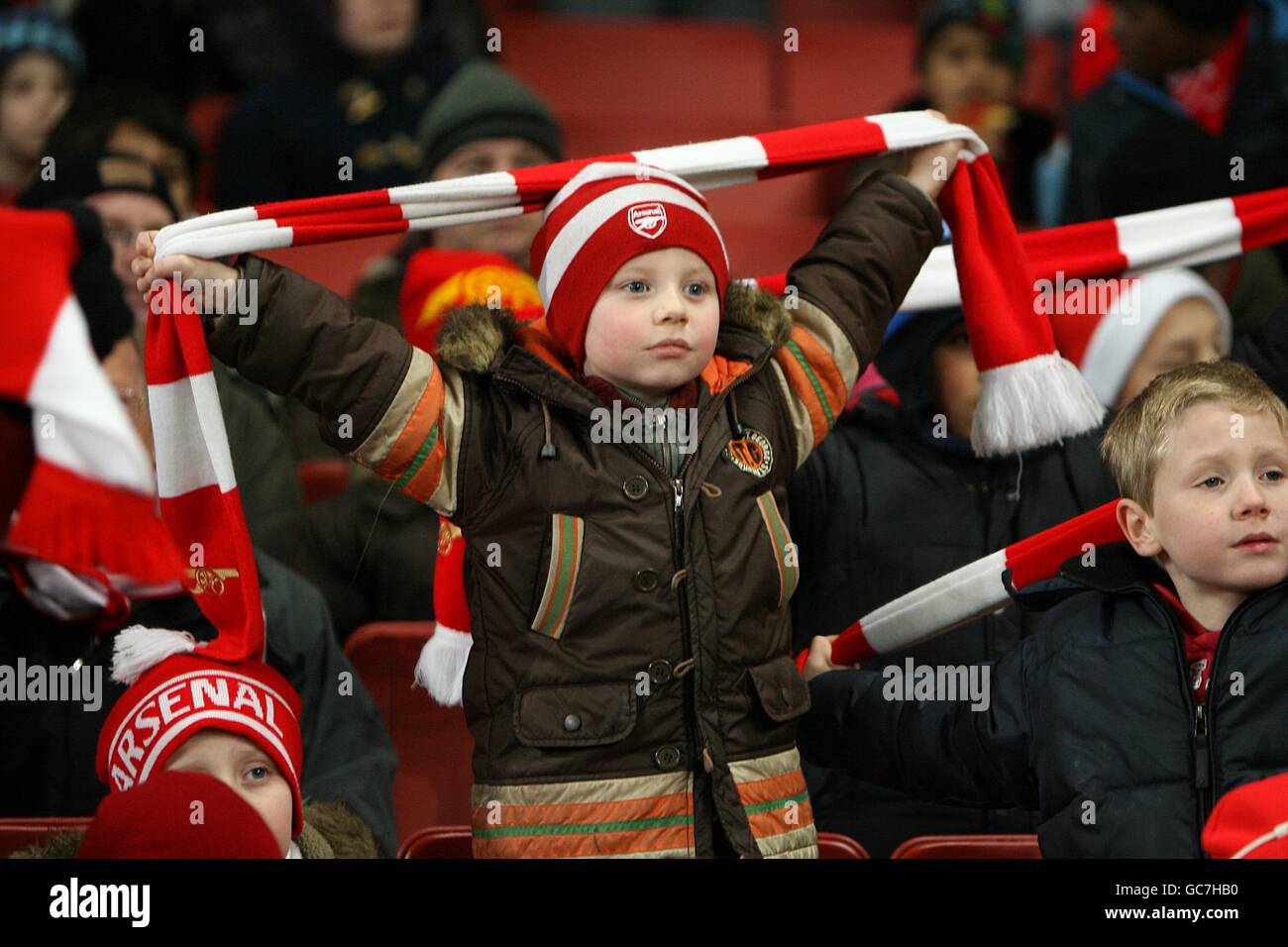Arsenal fans wave flags in stands hi-res stock photography and images ...