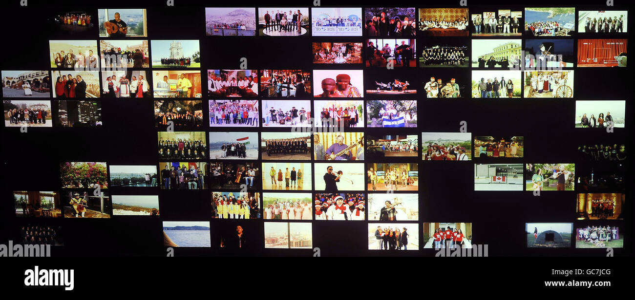 A giant screen shows streams from around the world, as artists from ...