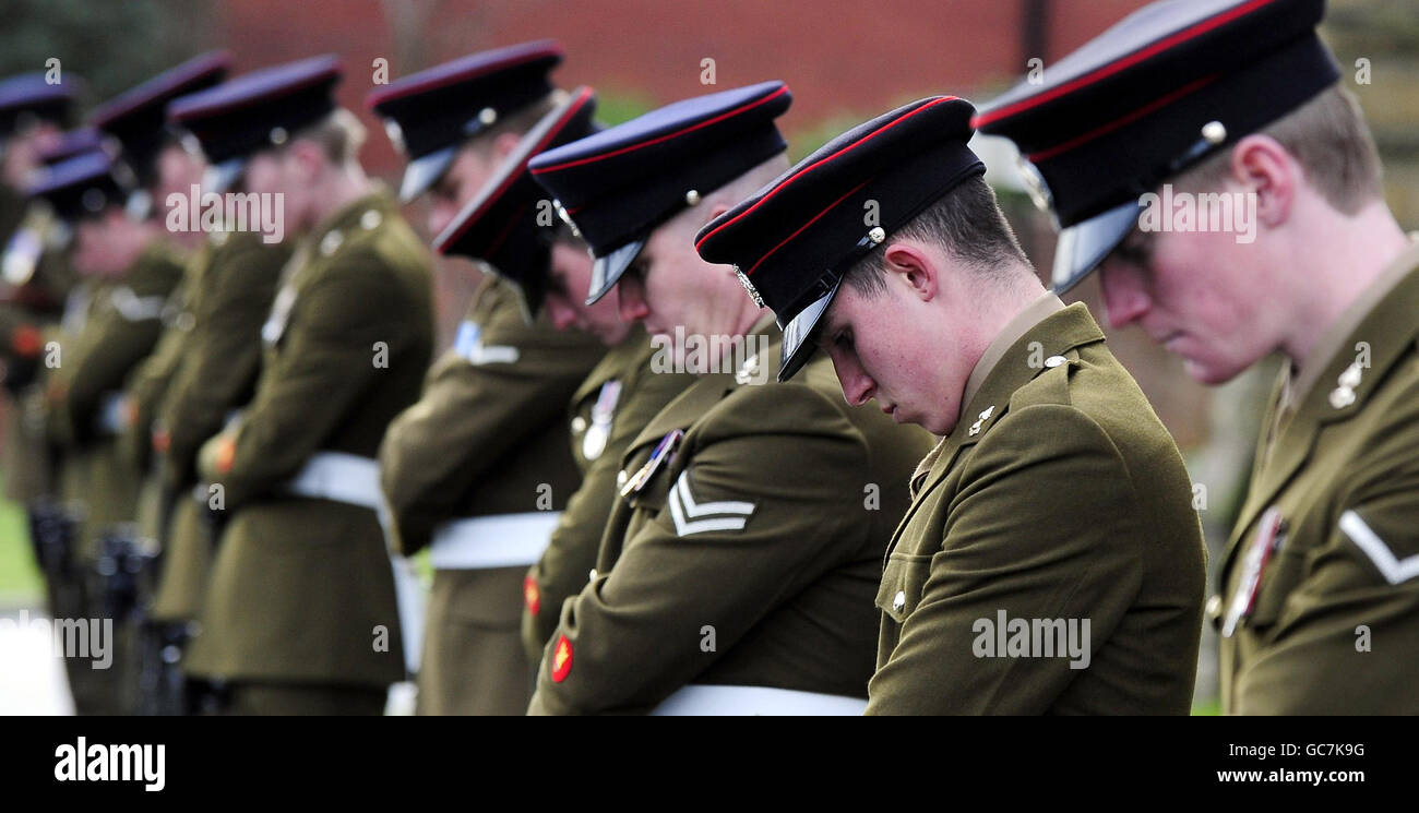 Soldiers pay their respects as the coffin of Army bomb disposal expert ...