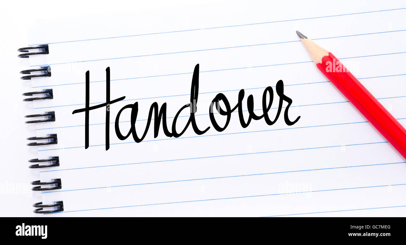 Handover written on notebook page with red pencil on the right Stock ...