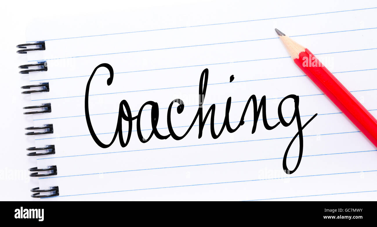 Coaching written on notebook page with red pencil on the right Stock ...
