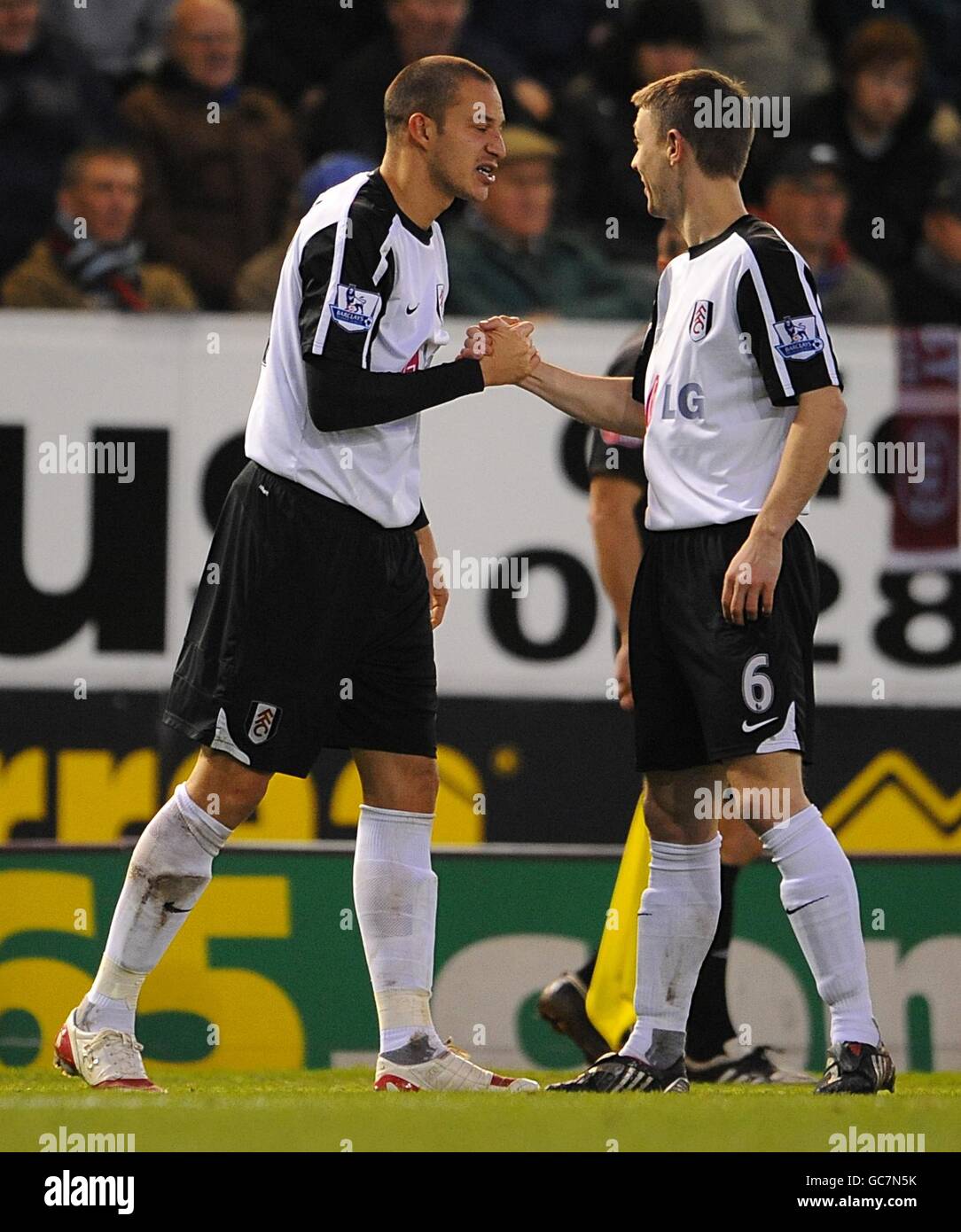 Fulham's Bobby Zamora (left) celebrates scoring the opening goal with ...