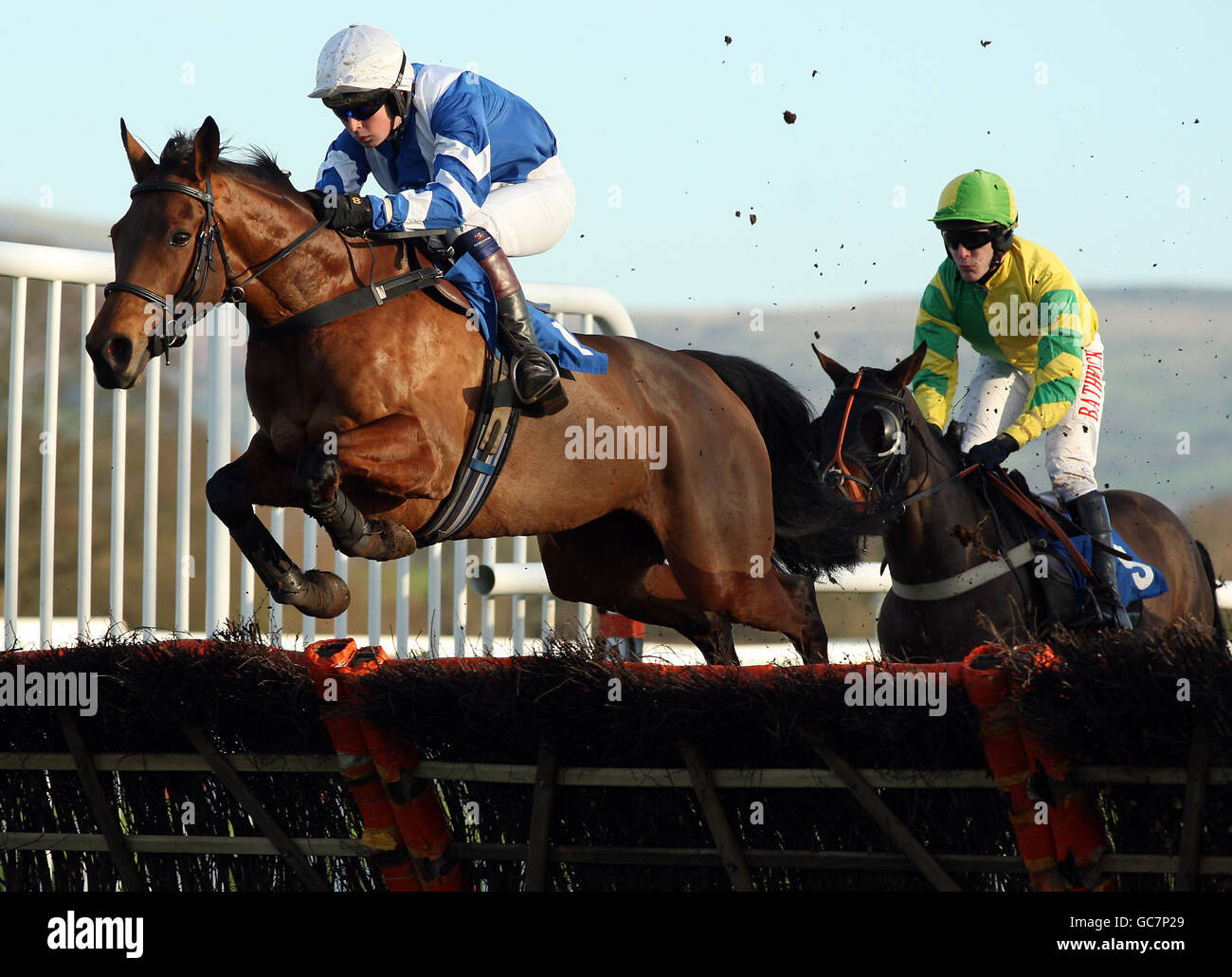 Jockey David Pritchard on Bella Haze (left) jumps ahead of Tom ...
