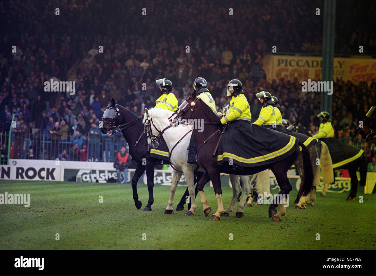 Mounted police move on to the pitch at Maine Road to quell crowd ...