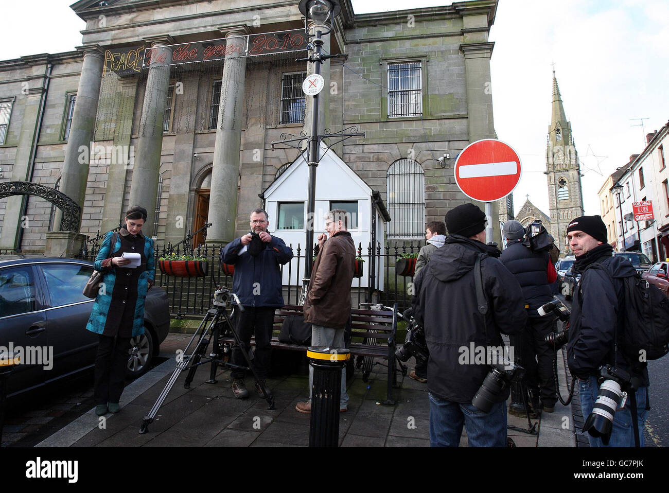 The media wait for Barry Michael McCarney, 30, to be led from Omagh ...