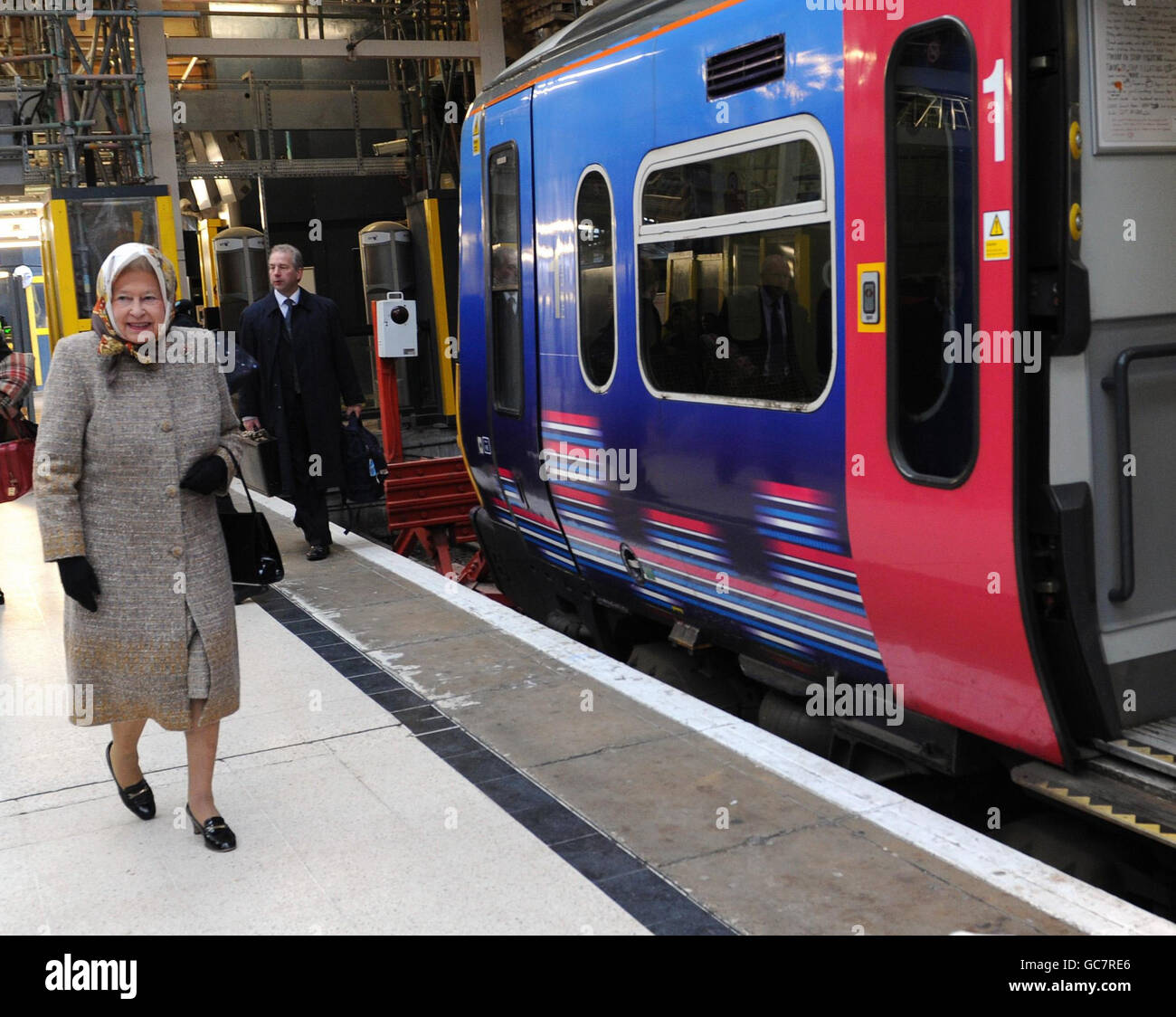 Britain's Queen Elizabeth II boards a First Capital Connect train to ...