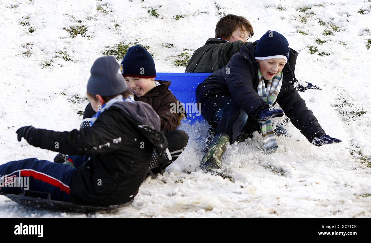 Children playing in the snow in Springfield in Chelmsford, Essex Stock ...
