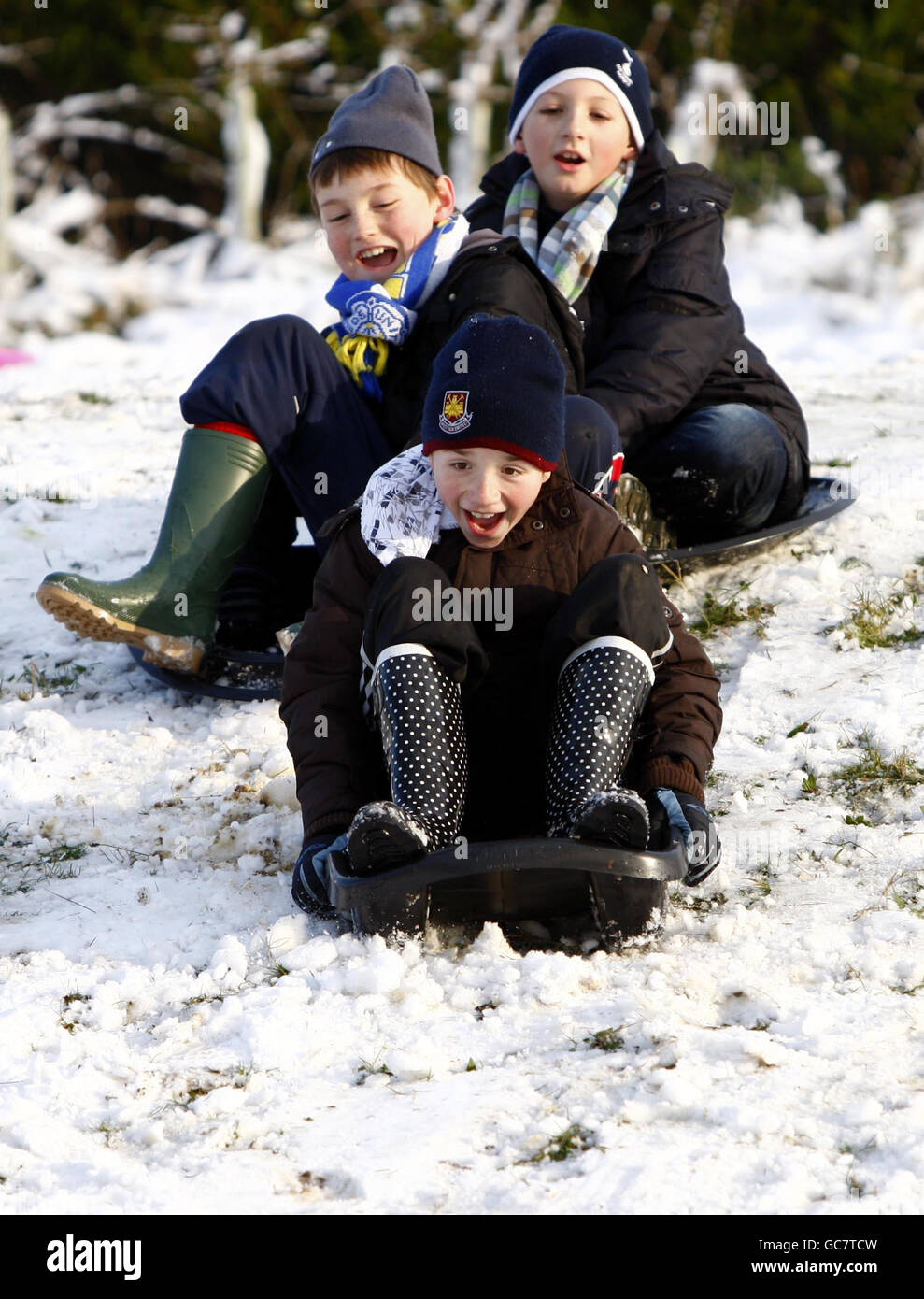 Children playing in the snow in Springfield in Chelmsford, Essex Stock ...