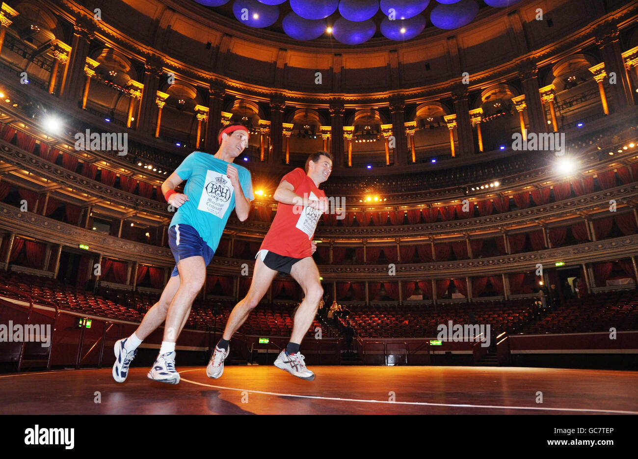 Runners from the Royal Albert Hall make their way around a track ...