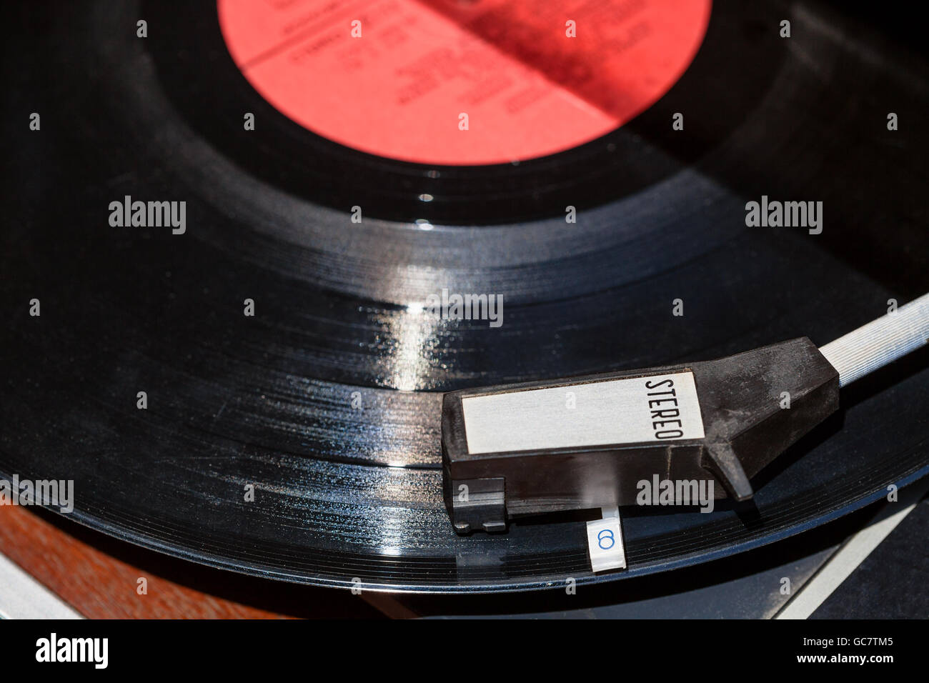 above view of tonearm on vinyl disc in old record player Stock Photo ...