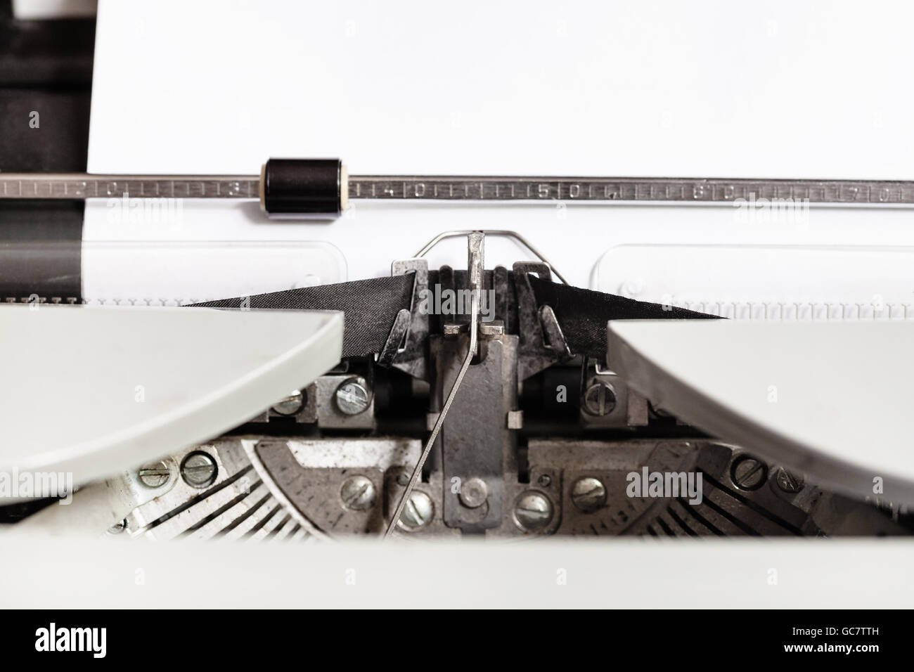 typebar hits ink ribbon in mechanical typewriter close up Stock Photo ...