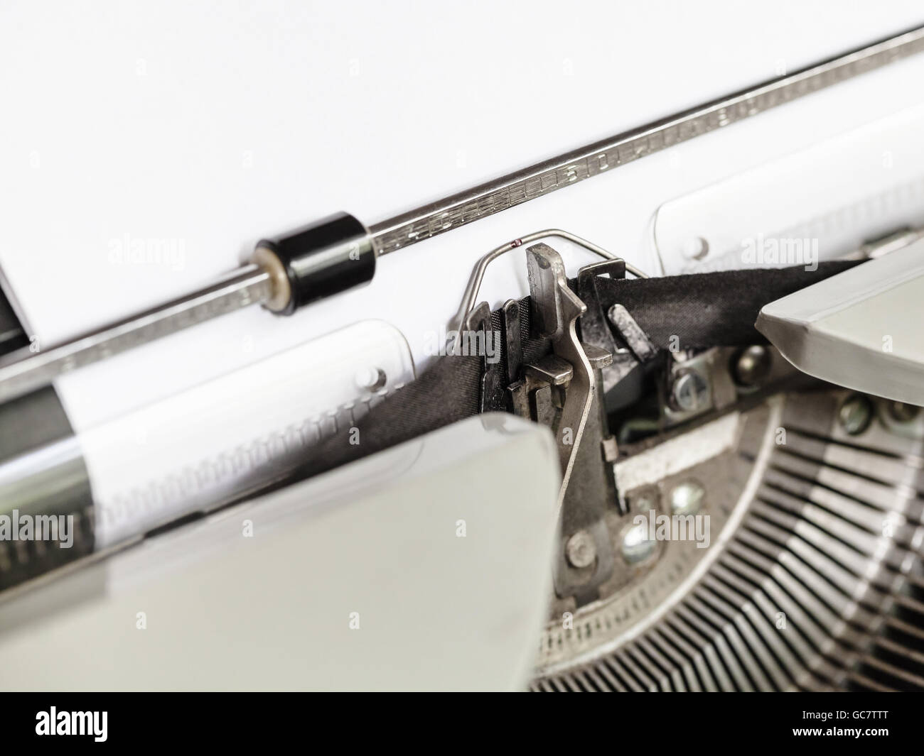 side view of typebar types ink ribbon in old typewriter Stock Photo - Alamy