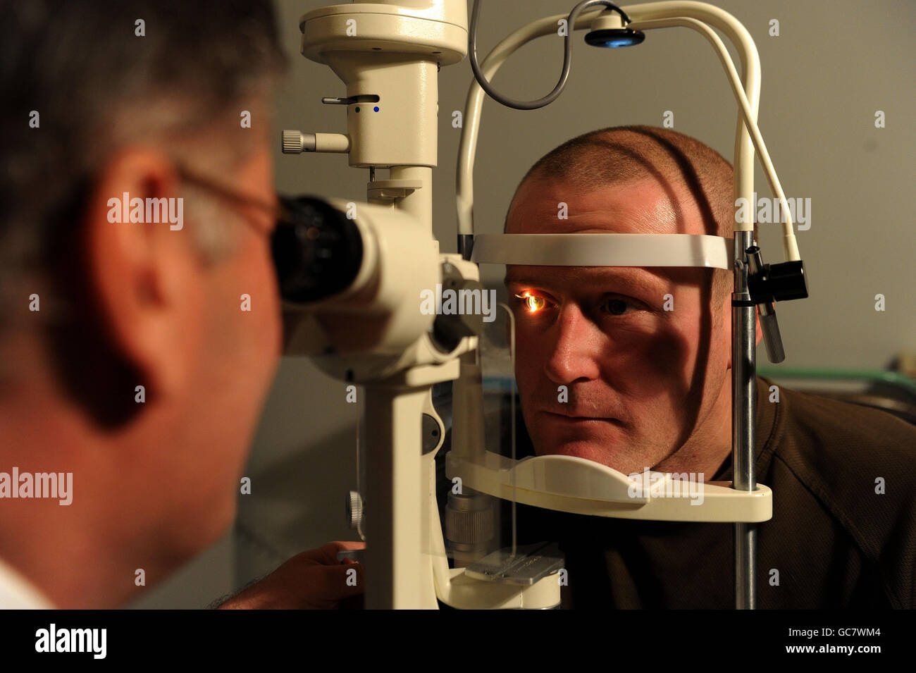 Eye patient Russell Turnbull and consultant surgeon Dr Francisco ...