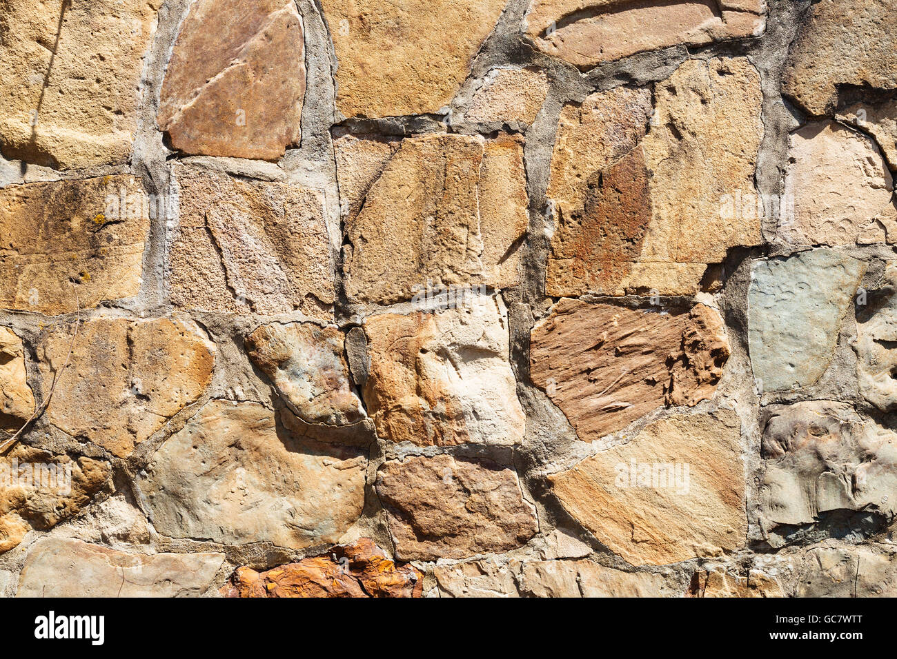 textured background - outdoor wall from natural cobbles Stock Photo - Alamy